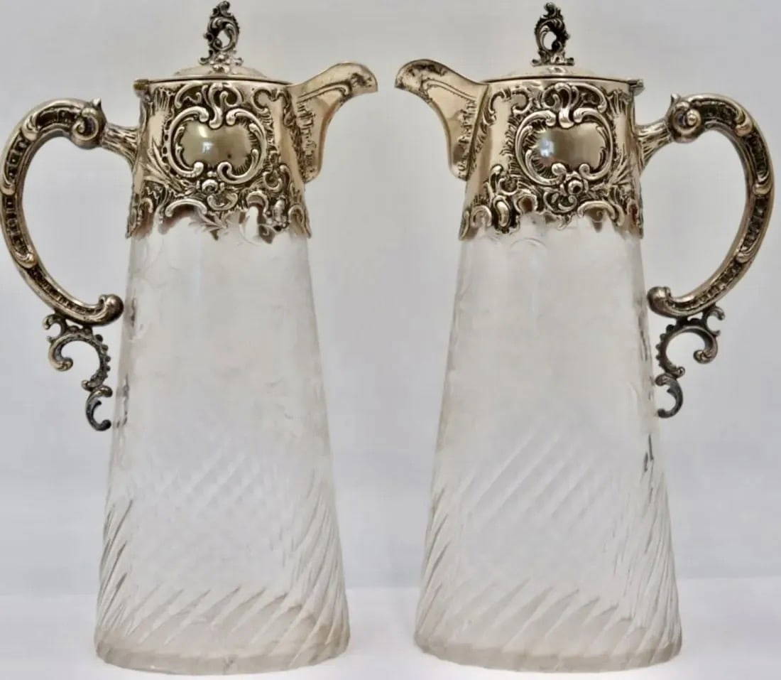 A Pair Of Antique Continental Silver And Crystal Pitchers Auction
