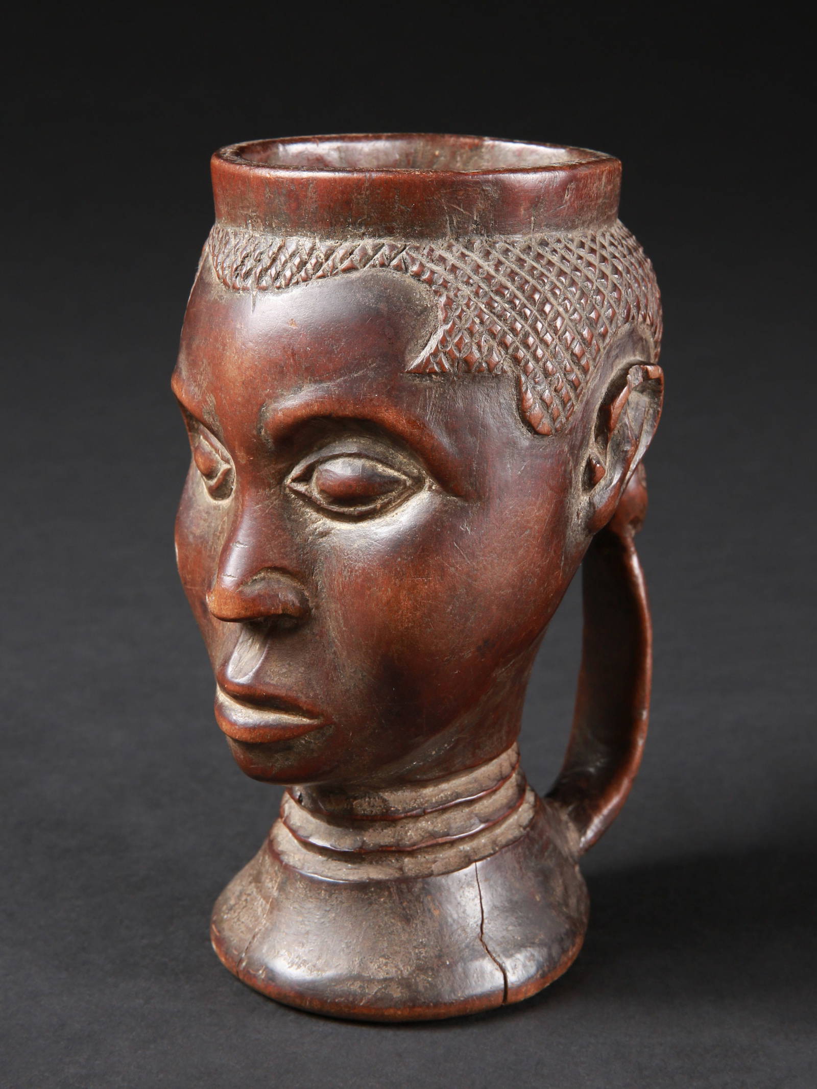 A Kuba Head-shaped Cup, "mbwoongntey" Auction