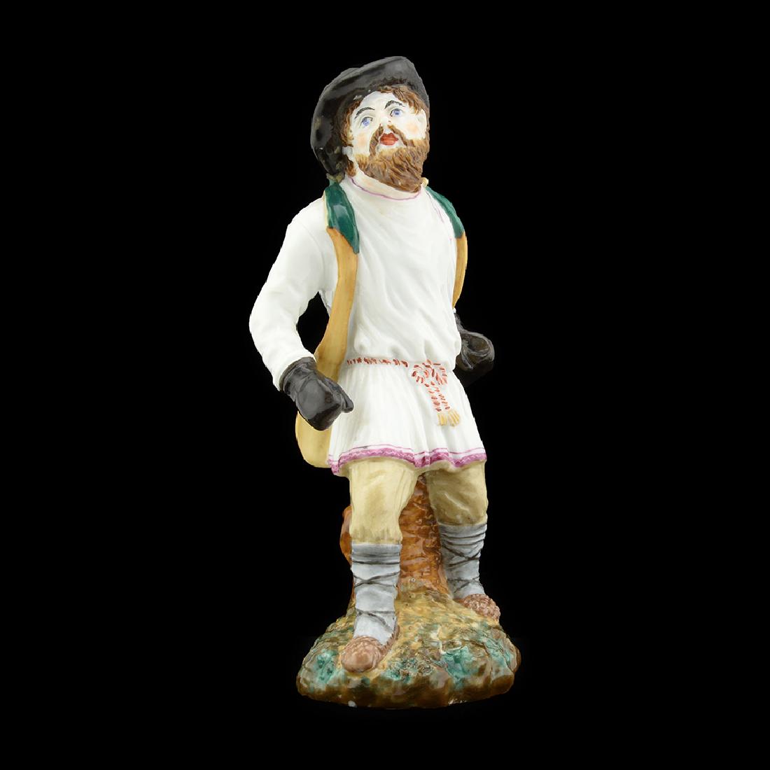 Antique Russian porcelain figure of a peasant boxer