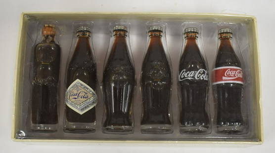 Evolution Of The Coca Cola Contour Bottle In Box