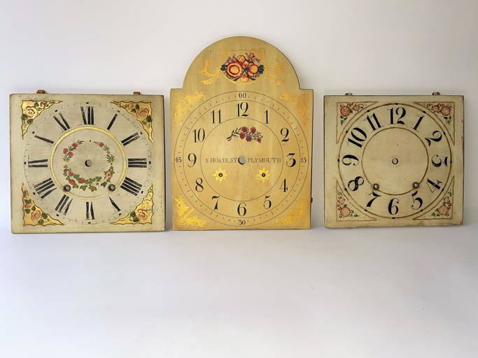 Grouping Of Wooden Clock Faces