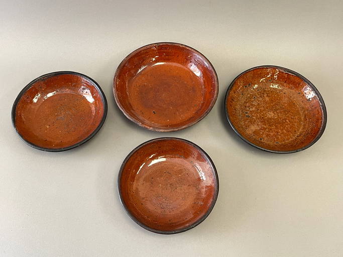 Grouping Of Four Redware Plates