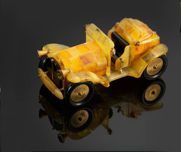 A Miniature Classic Car Model Made From Natural Kahram