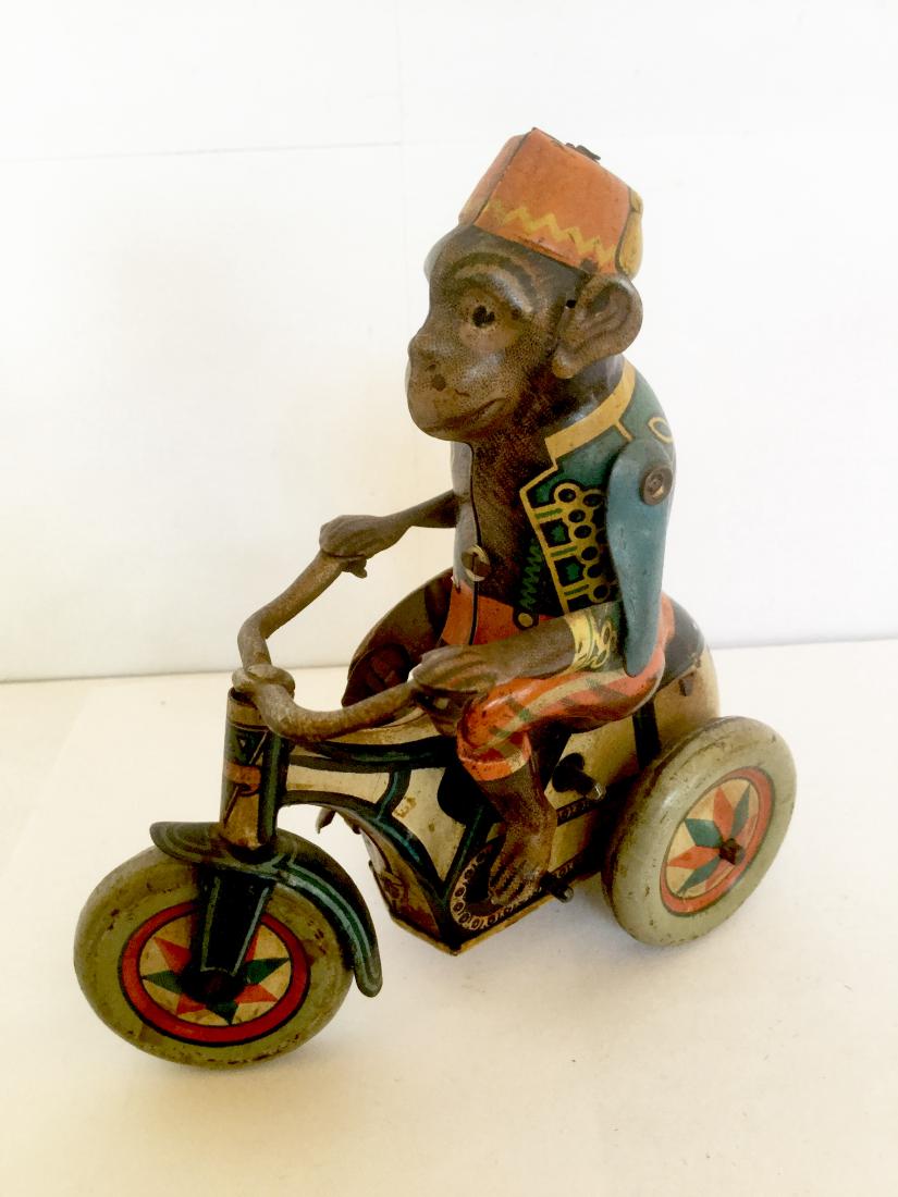 Monkey Riding Tricycle Wind Up Toy