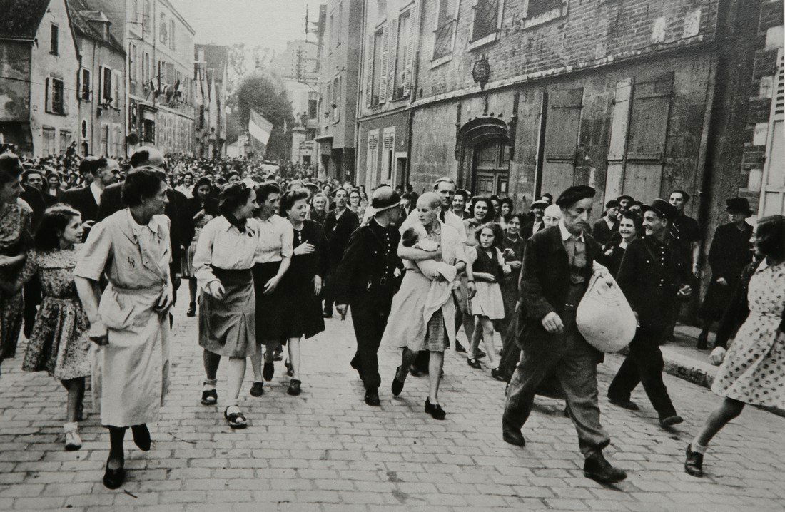 ROBERT CAPA - Woman collaborator is paraded, Chartres