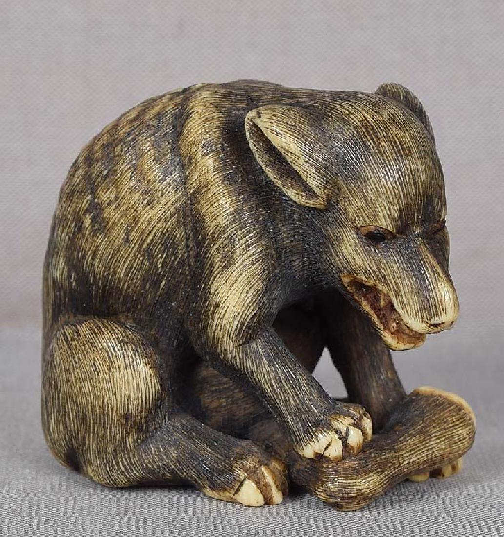 Antique Japanese Staghorn Netsuke Wolf With Deer Leg