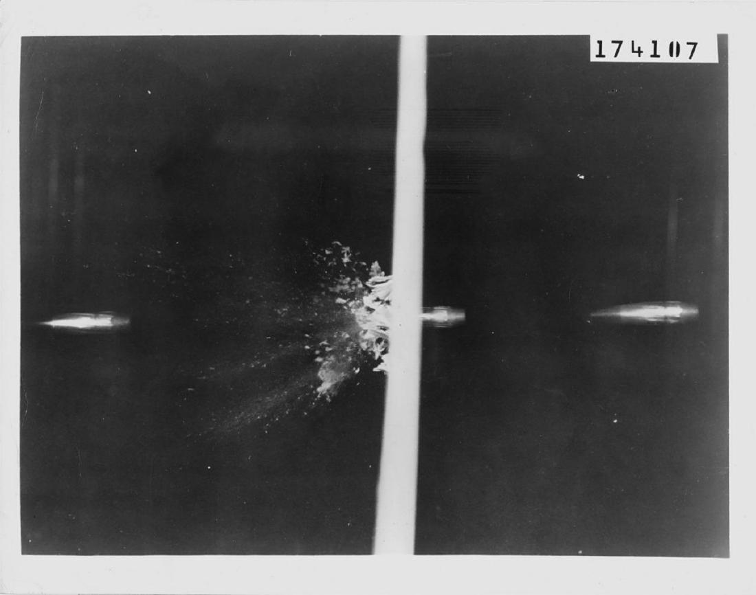 High Speed Photograph Bullet Passing Through a Board