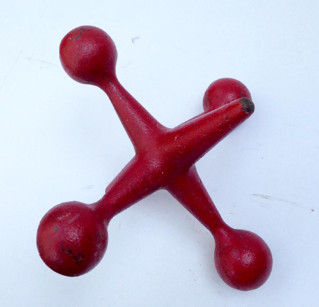Early 20thc Cast Iron Jack Doorstop in Old Red Paint