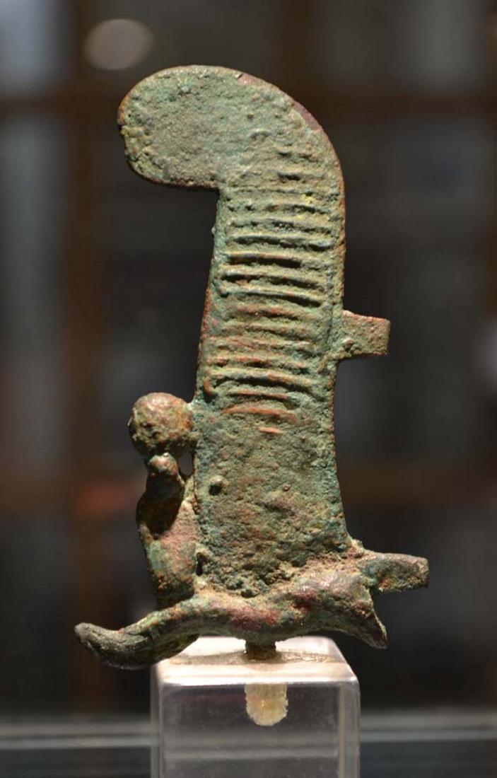 An Ancient Egyptian Bronze Atef Crown Feather