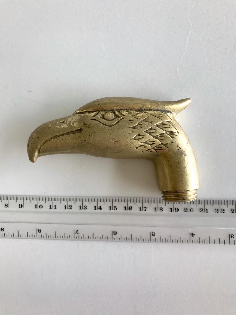 Vintage bronze cane handle depicting the bird head
