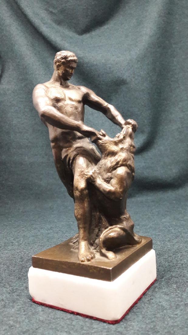 Antique figure, a statue of Samson, tearing the jaws of