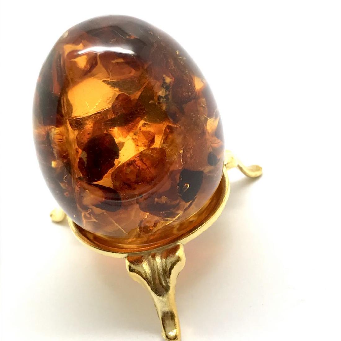 Baltic Amber egg 57x44mm on the stand