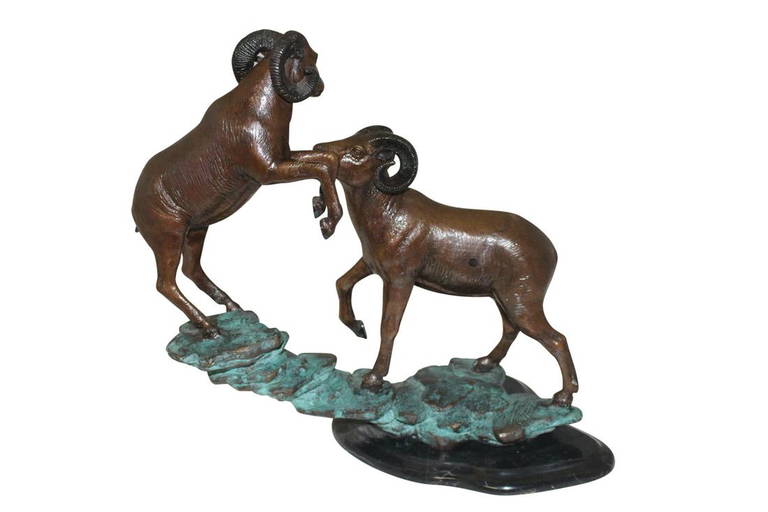 Two Rams On A Rock Bronze Statue – Size: 15″l X 8″w X 16″h.
