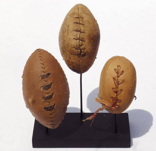 A Collection Of Three Old, Hand Made, Miniature Leather Footballs