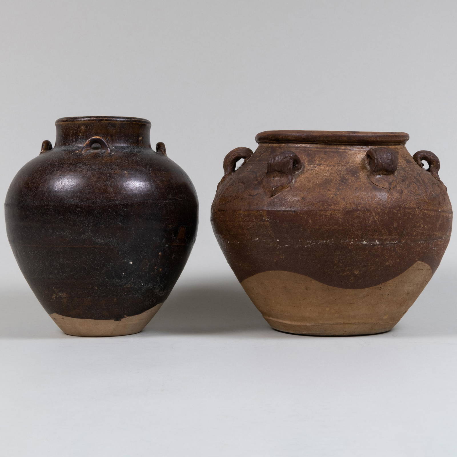 Two Chinese Pottery Jars With Lug Handles Auction