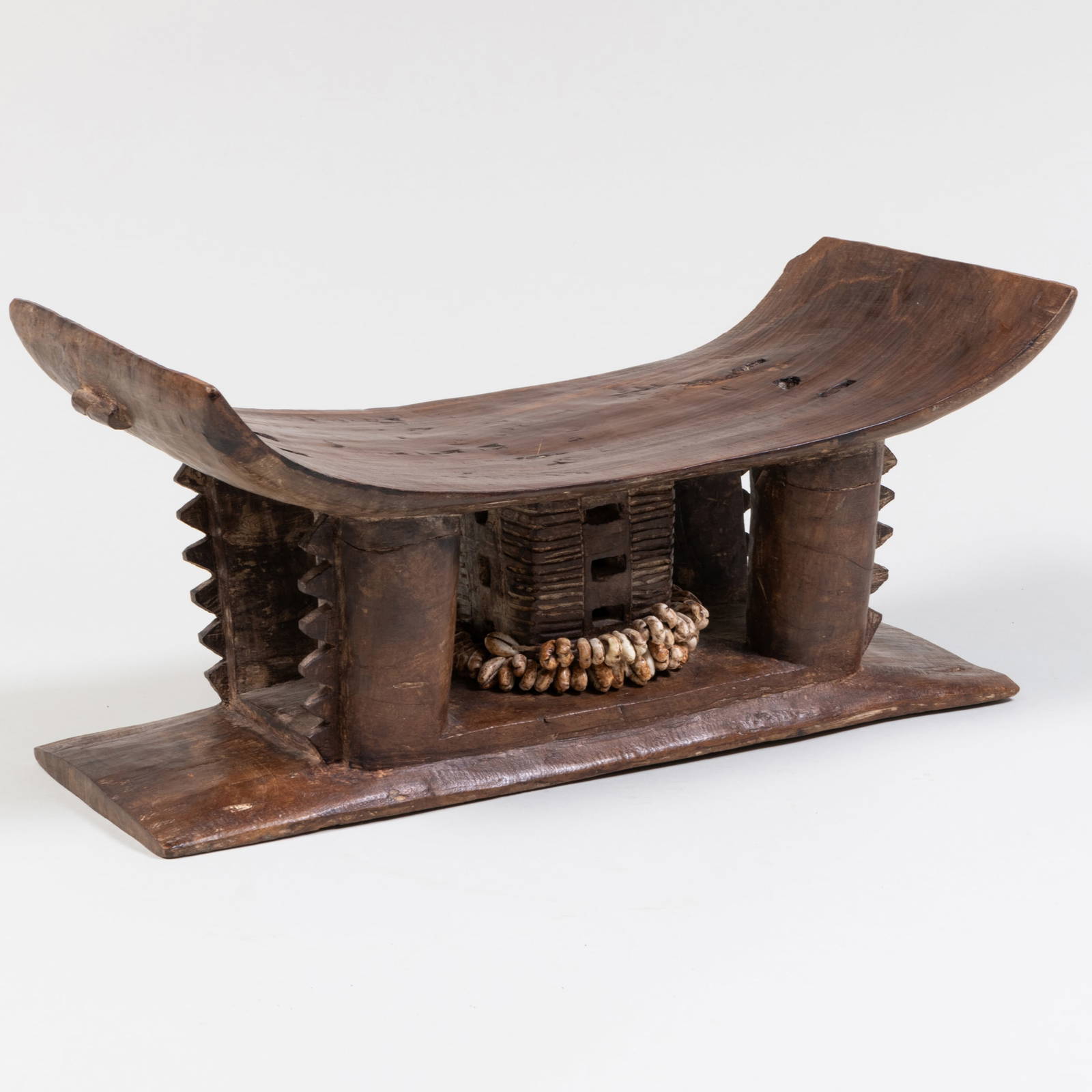 Ashanti Carved Hardwood And Conch Shell Decorated Stool, Ghana Auction