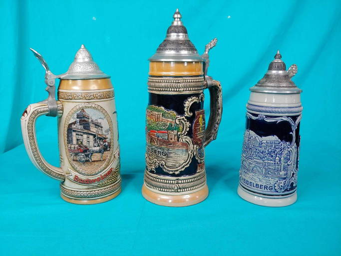 Three Beer Steins With Lids