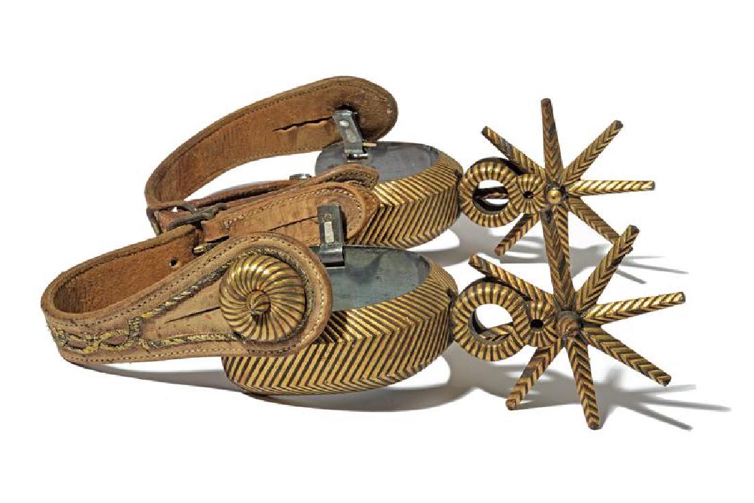 A rare and beautiful pair of spurs with gold decoration