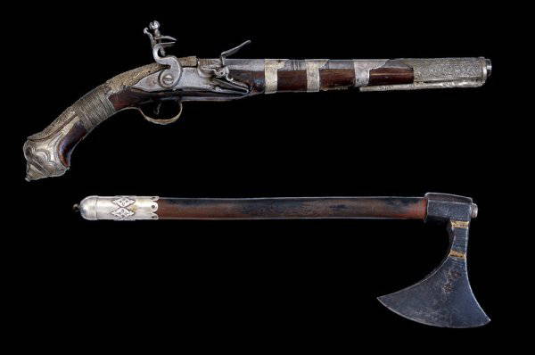A Flintlock Pistol And A Battle Axe