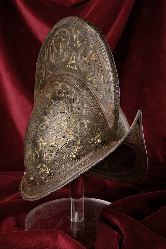 An extremely rare, etched and gilded high comb morion