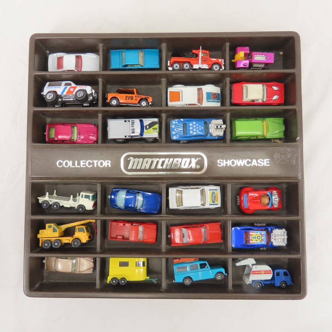 24 Vintage Matchbox Cars In Collector Showcase Auction