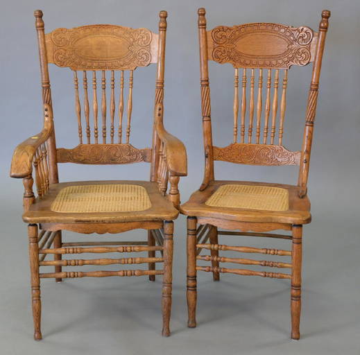 Set Of Seven Oak Pressed Back Chairs With Caned Seats