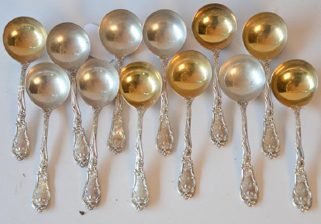 Set of twelve sterling silver soup spoons, some with