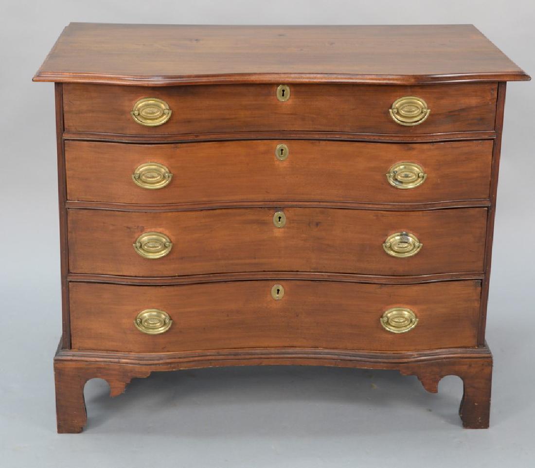 Cherry four drawer chest having molded overhanging top
