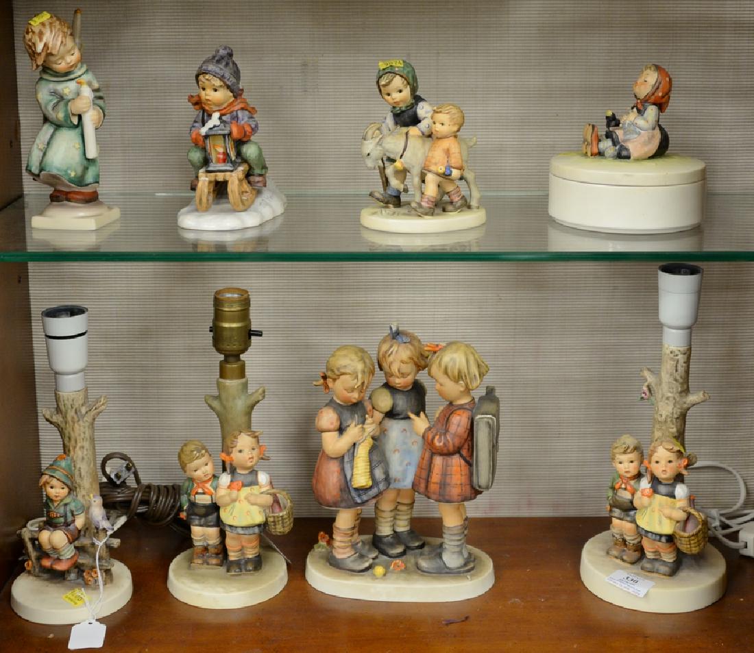 Eight large Hummel figurines to include three lamps,