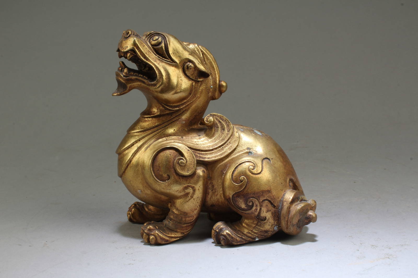 A Gilt Bronze Mythical Beast Statue Auction