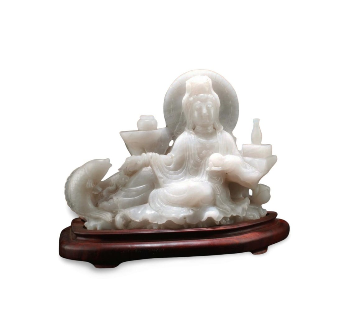 A Large Chinese Jadestone Guanyin Carving With Sta Auction