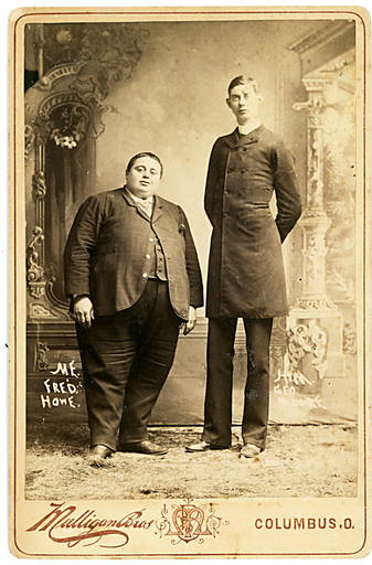 Fred Howe (fat Man) And George Moore (tall Man.)
