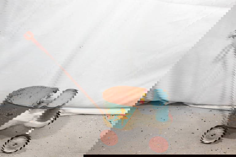 Antique Metal Doll Push Toy