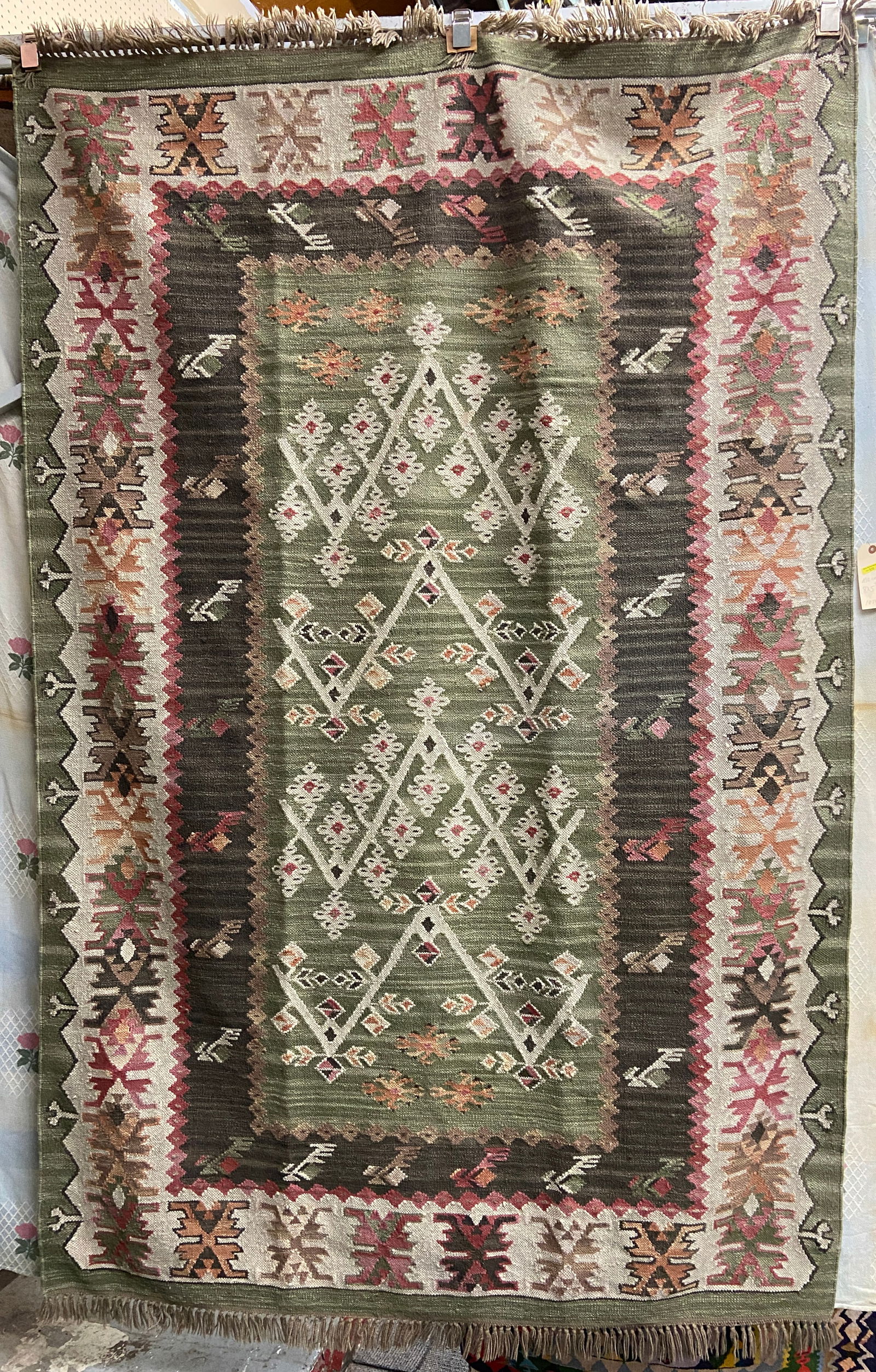 5' 5" X 8' Green Kelim Rug. Auction