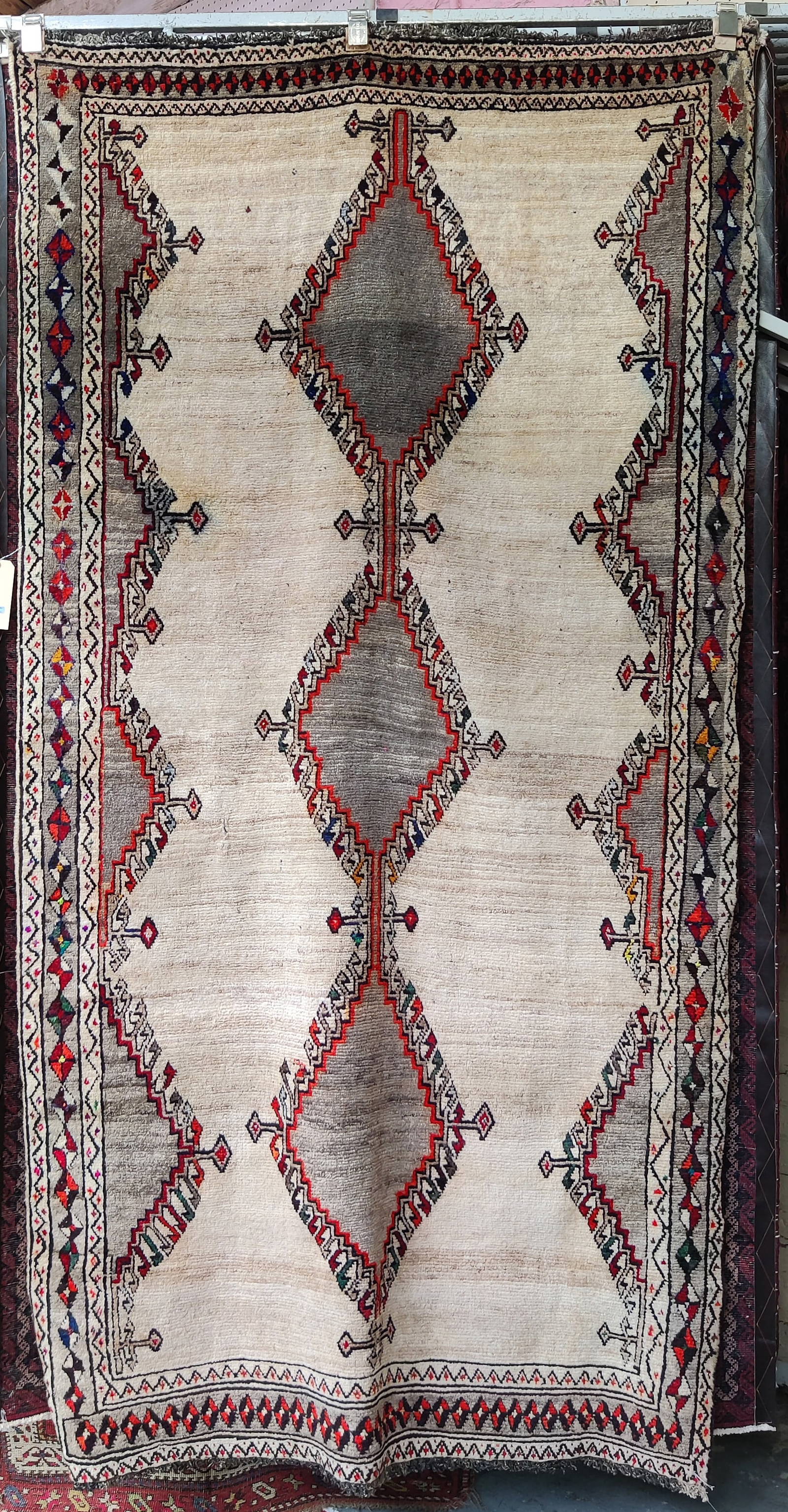 4' 3" X 8' 2" Beige & Grey Tribal Pattern Rug. Auction