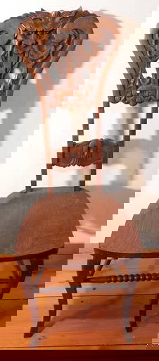 Carved North Wind Face Chair