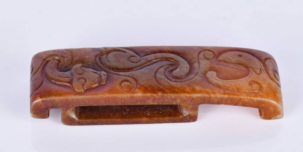 A Carved Jade Sword Slide Qing Auction