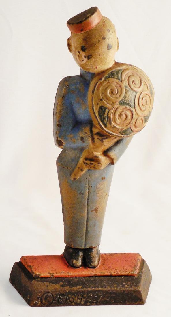 Cast Iron Doorstop Bellhop with Flowers