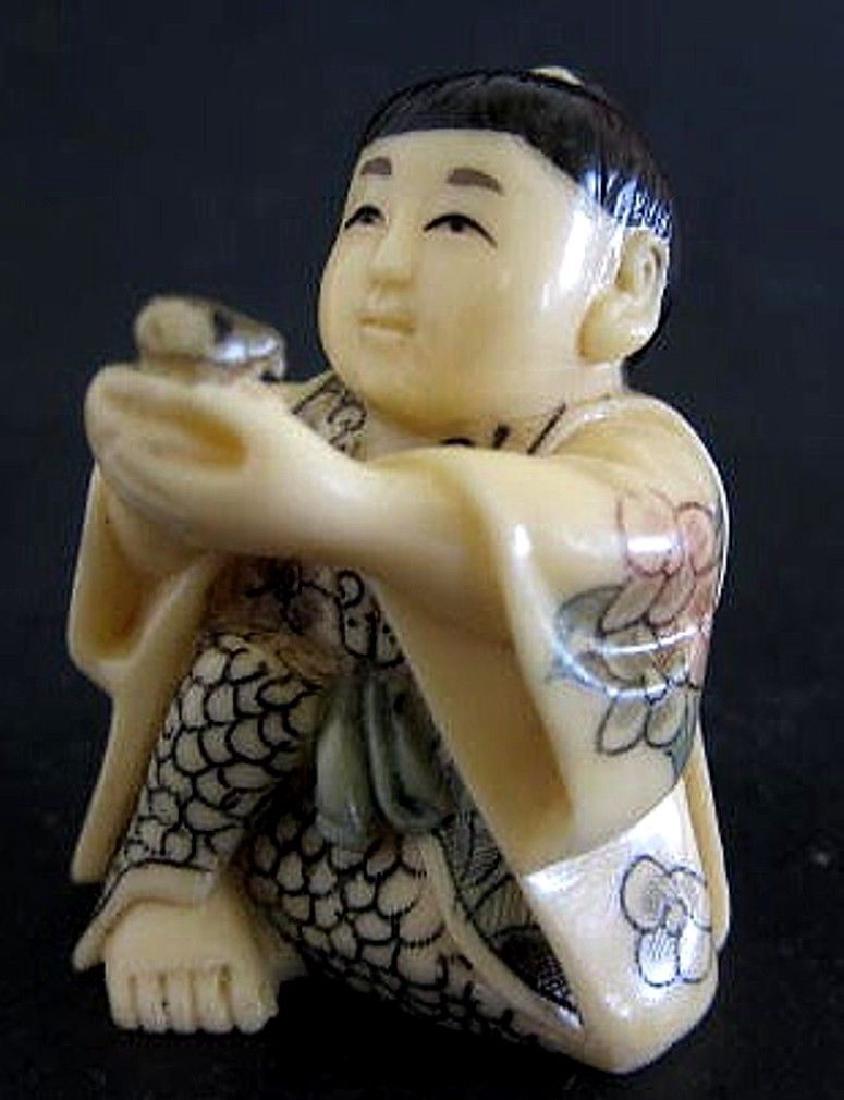 Japanese ivory color bone netsuke -Chinese Boy Offers U