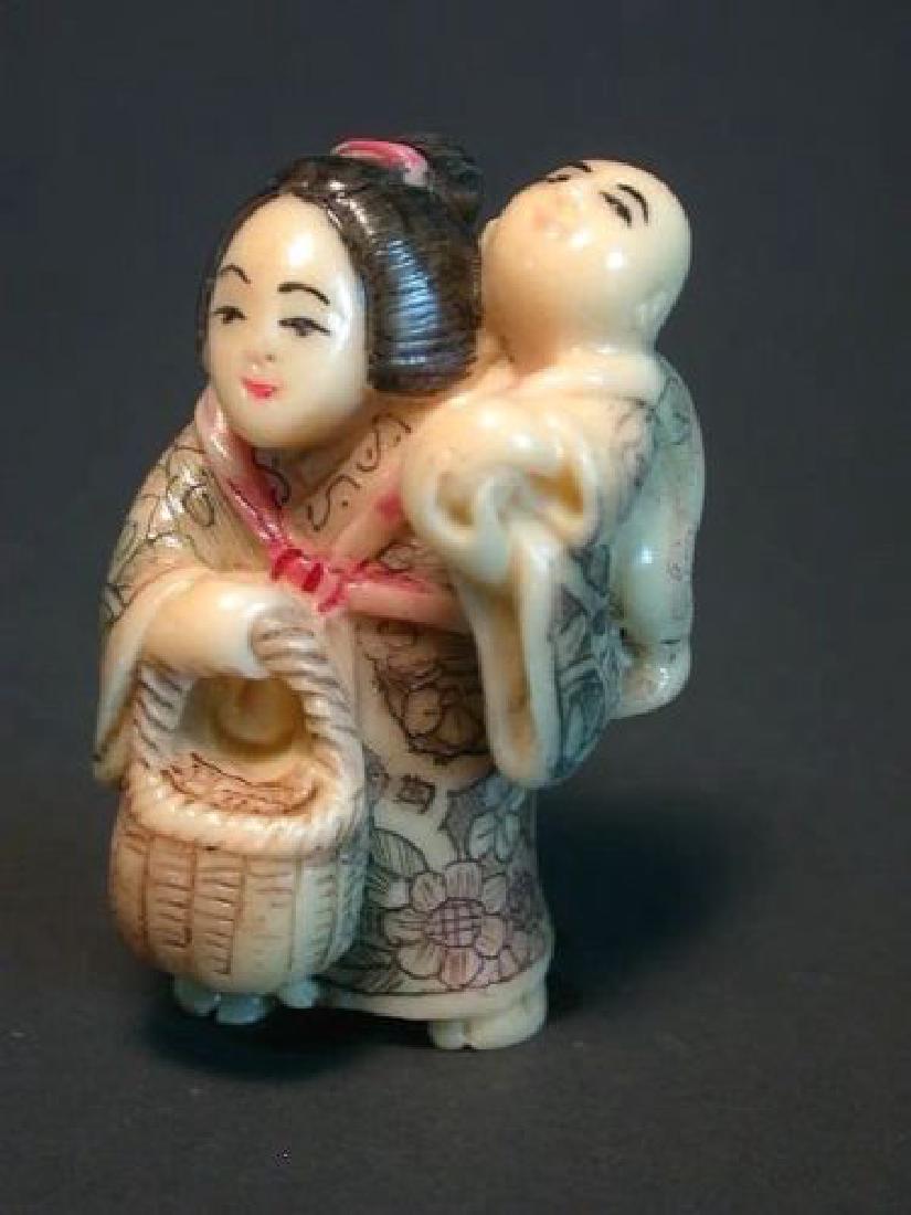 Japanese ivory colored bone netsuke -Mother Geisha