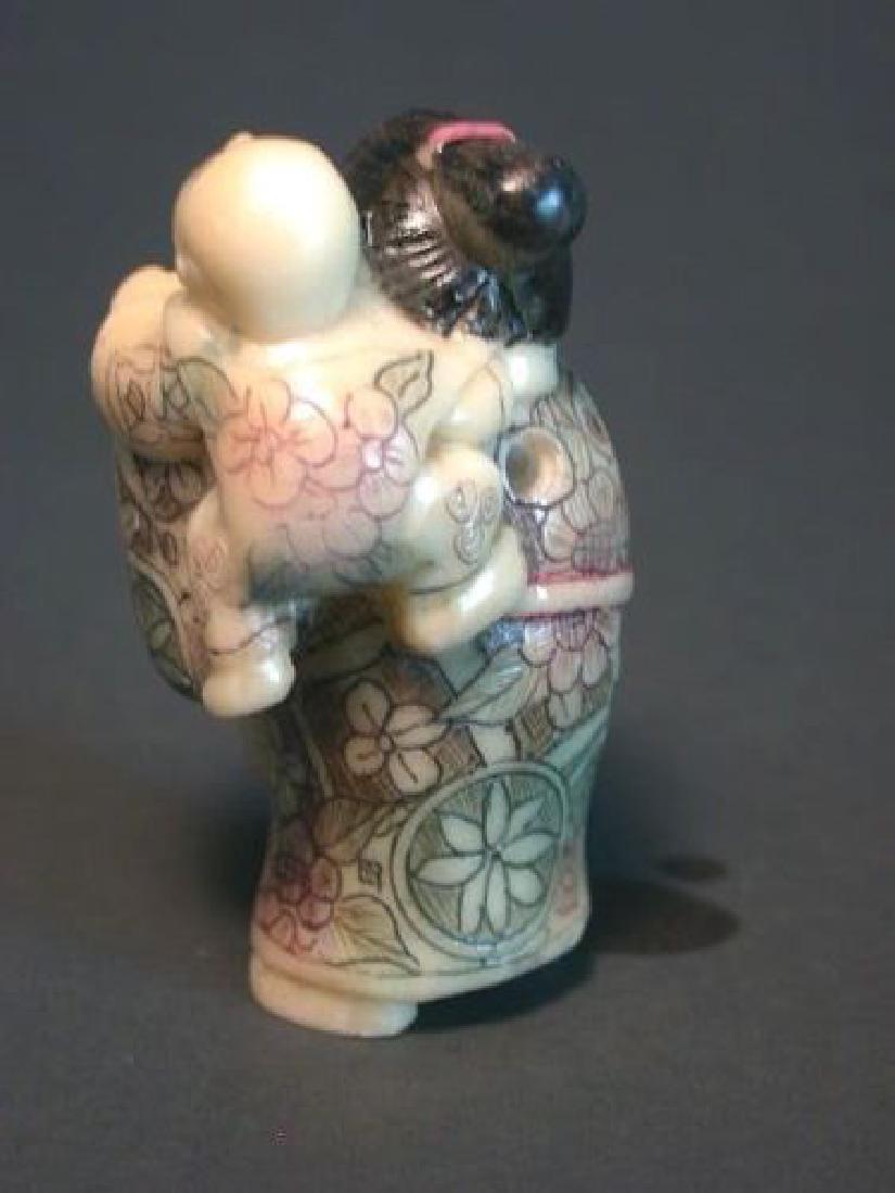 Japanese ivory colored bone netsuke -Mother Geisha