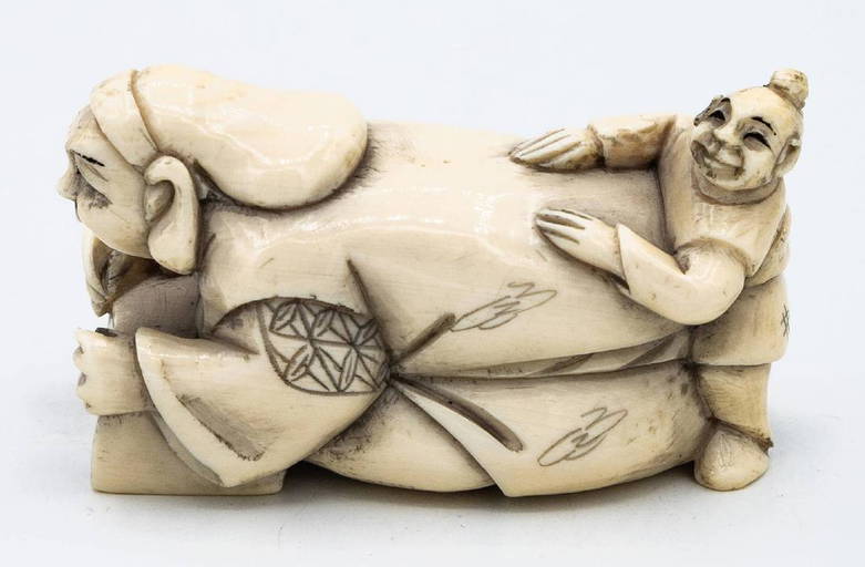 A Carved Katabori Netsuke Of A Mother And Child,