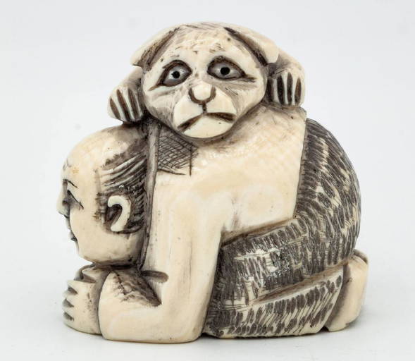 A Carved Katabori Netsuke Of A Man And A Dog,