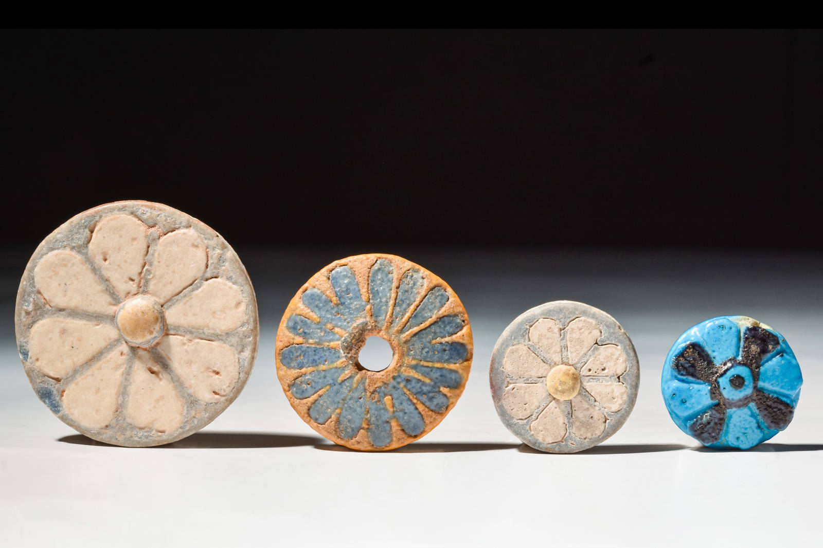 Four Egyptian Rosette Inlays Auction