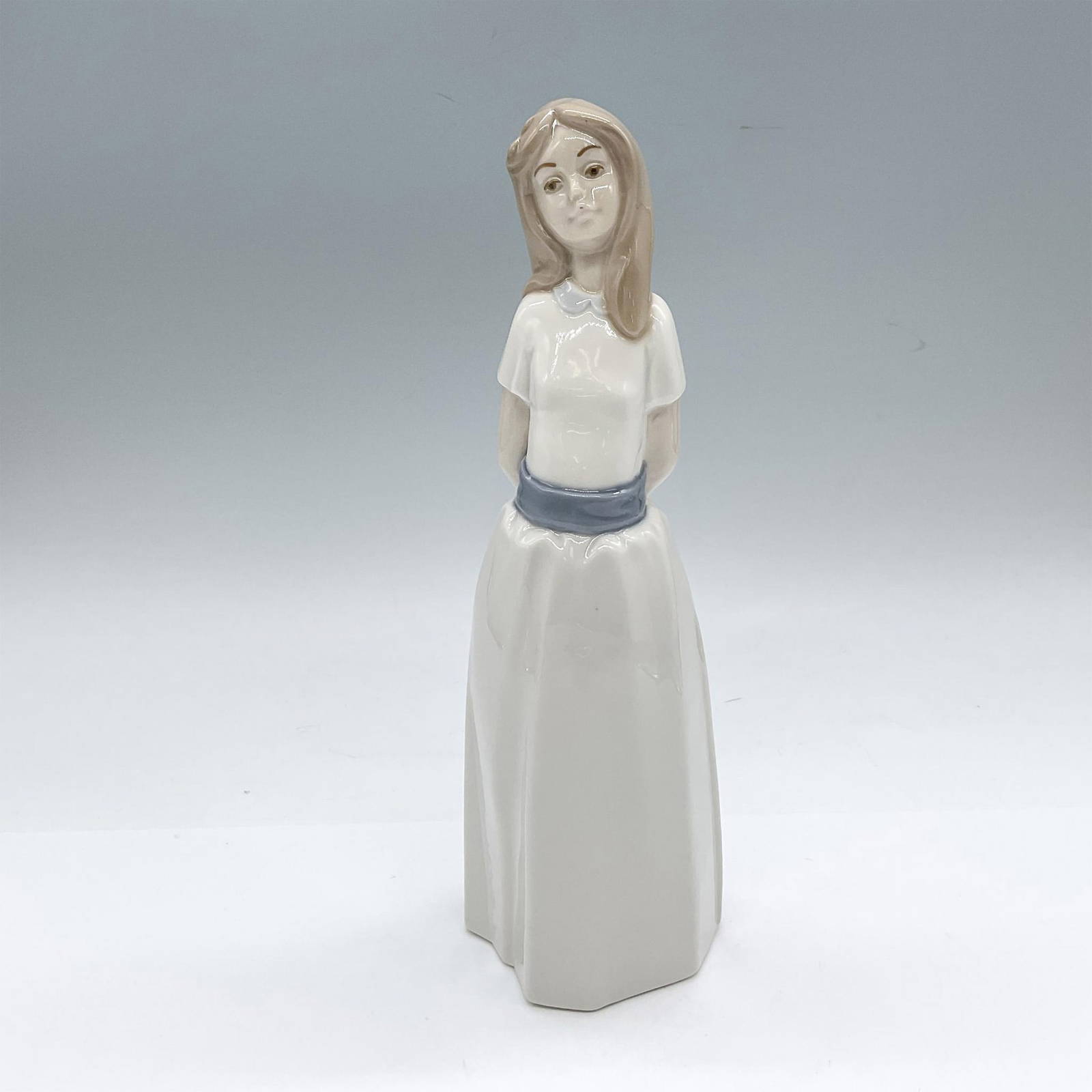 Nadal Porcelain Figurine, Girl Smiling Auction