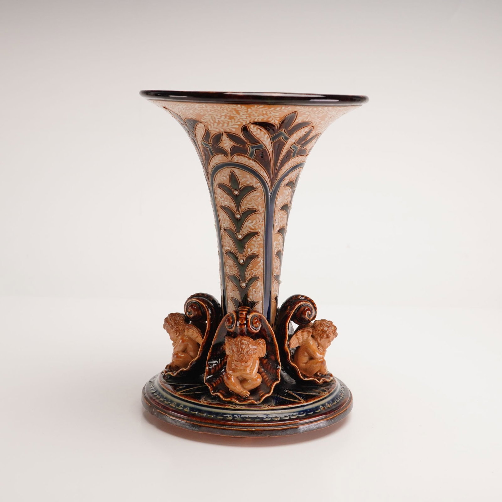 Doulton Lambeth Stoneware Trumpet Vase With Cherubs, Dated 1879 Auction