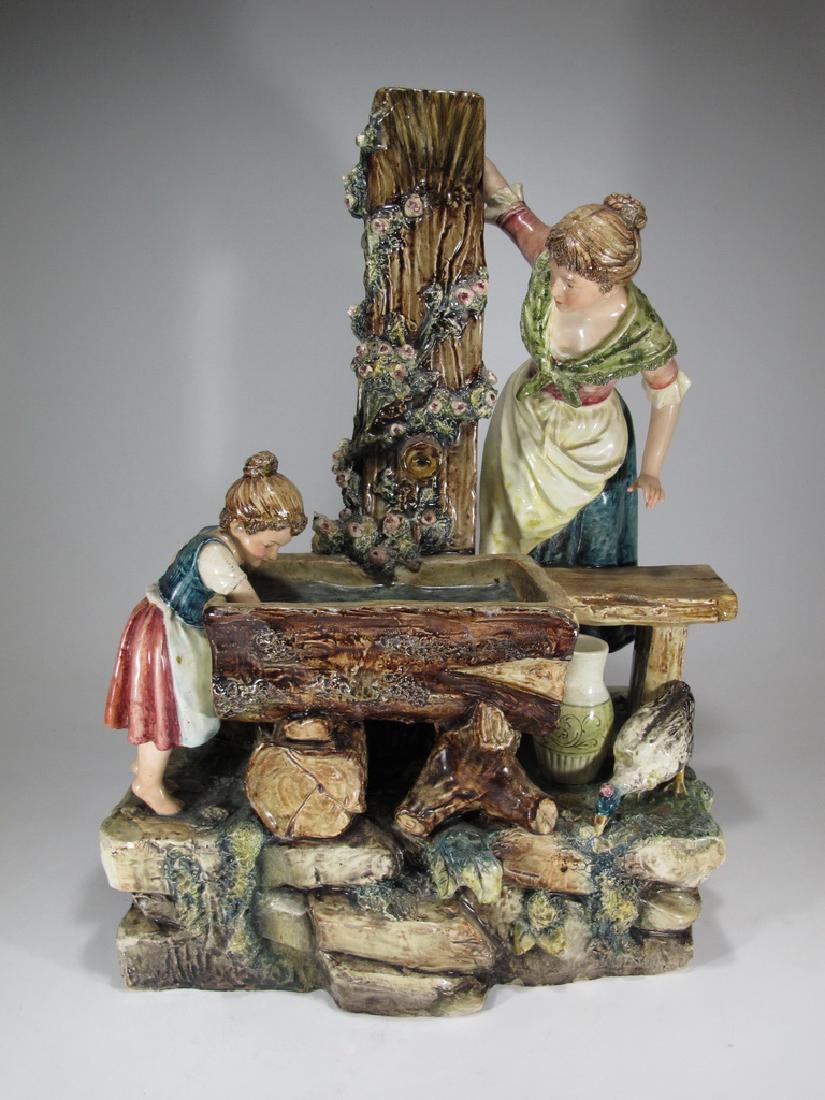 Antique European majolica washerwoman sculpture