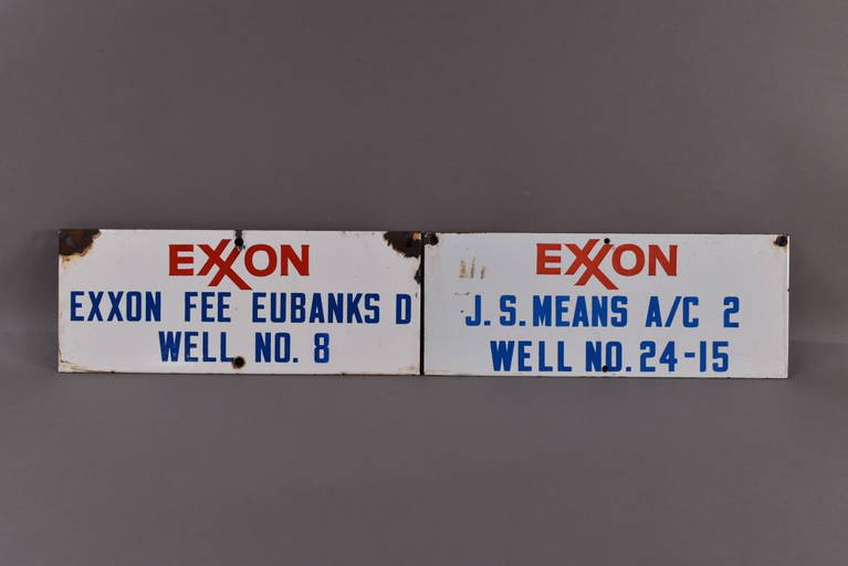 Pair Of Exxon Well Signs