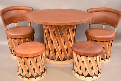A Mexican Equipale Dining Table And Chairs