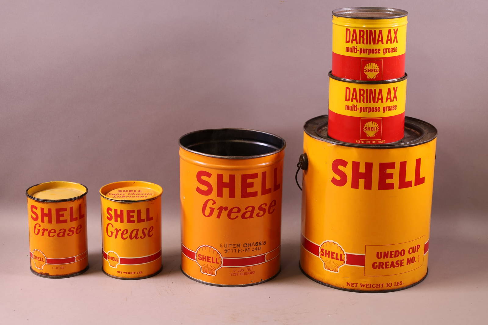 Six Shell Grease Cans Auction